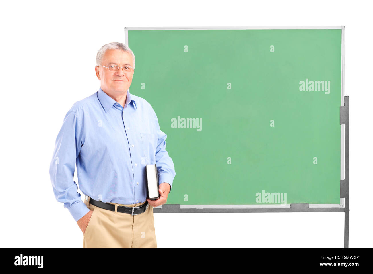 Mature school teacher holding a book isolated on white background Stock ...