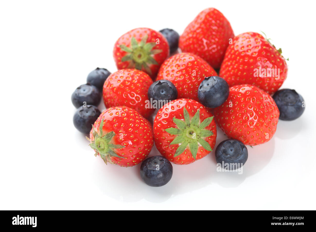 Fresh blueberries and strawberries. White background Stock Photo - Alamy