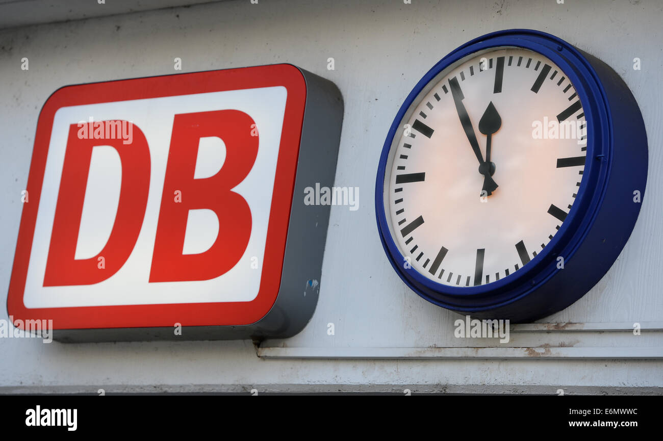 A station clock shows five minutes to twelve at the station in Fulda ...