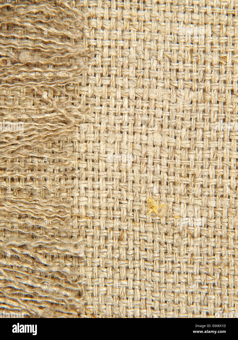 Natural linen texture with fringe taken closeup as abstract background ...