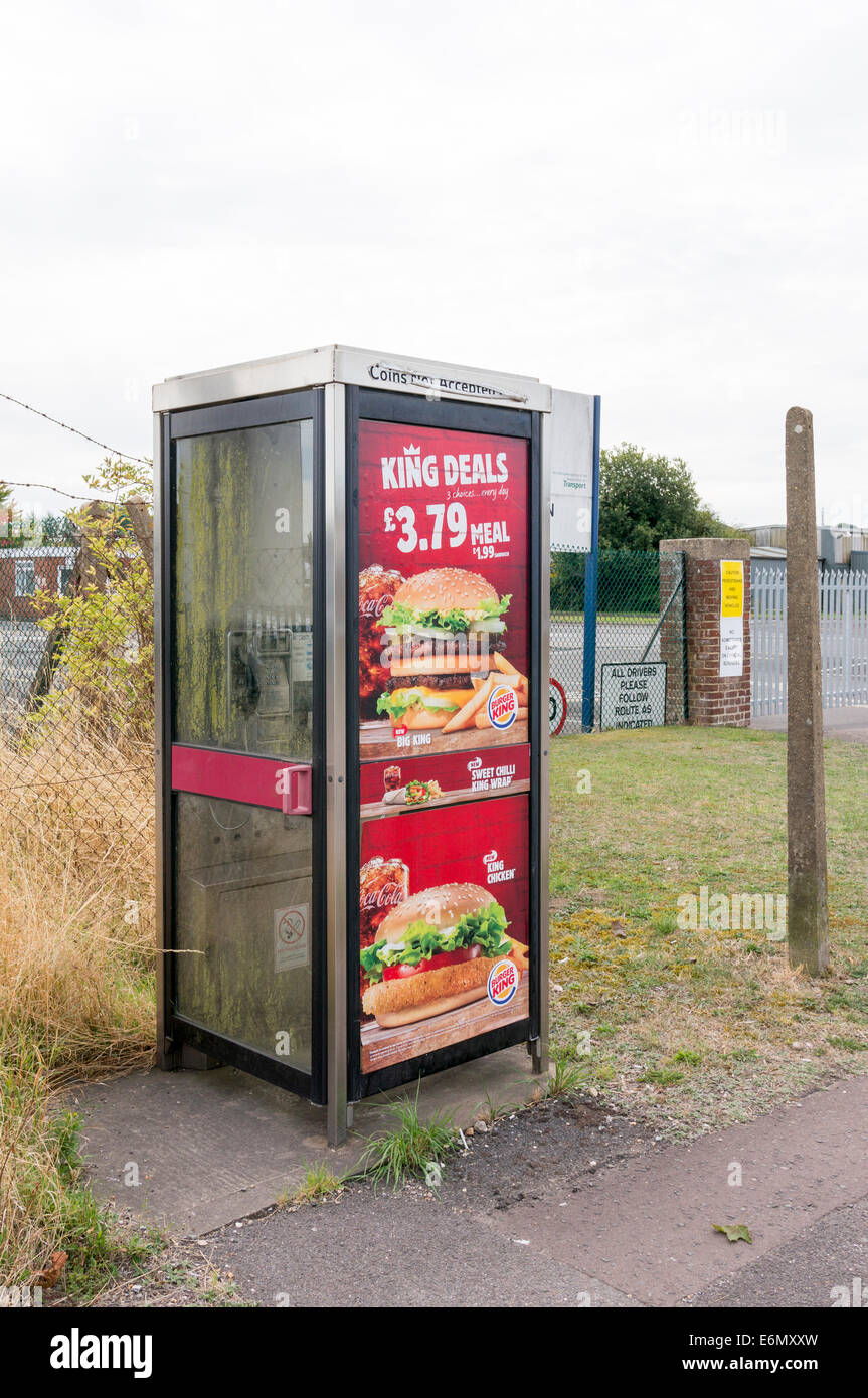 Burger King food advertising posters on UK public telephone kiosk Stock ...