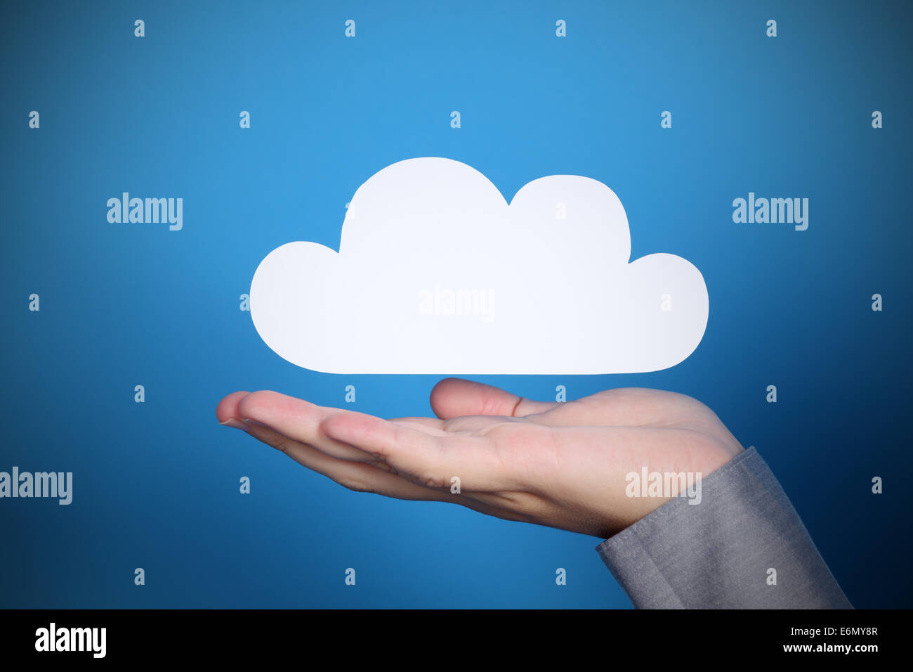 Woman's hand holding a paper cloud. Cloud computing concept Stock Photo ...