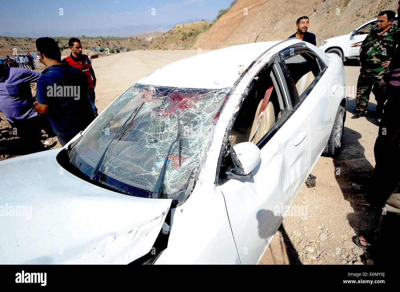 Duhok, Iraq. 27th Aug, 2014. A car that plunged into a ditch off the ...