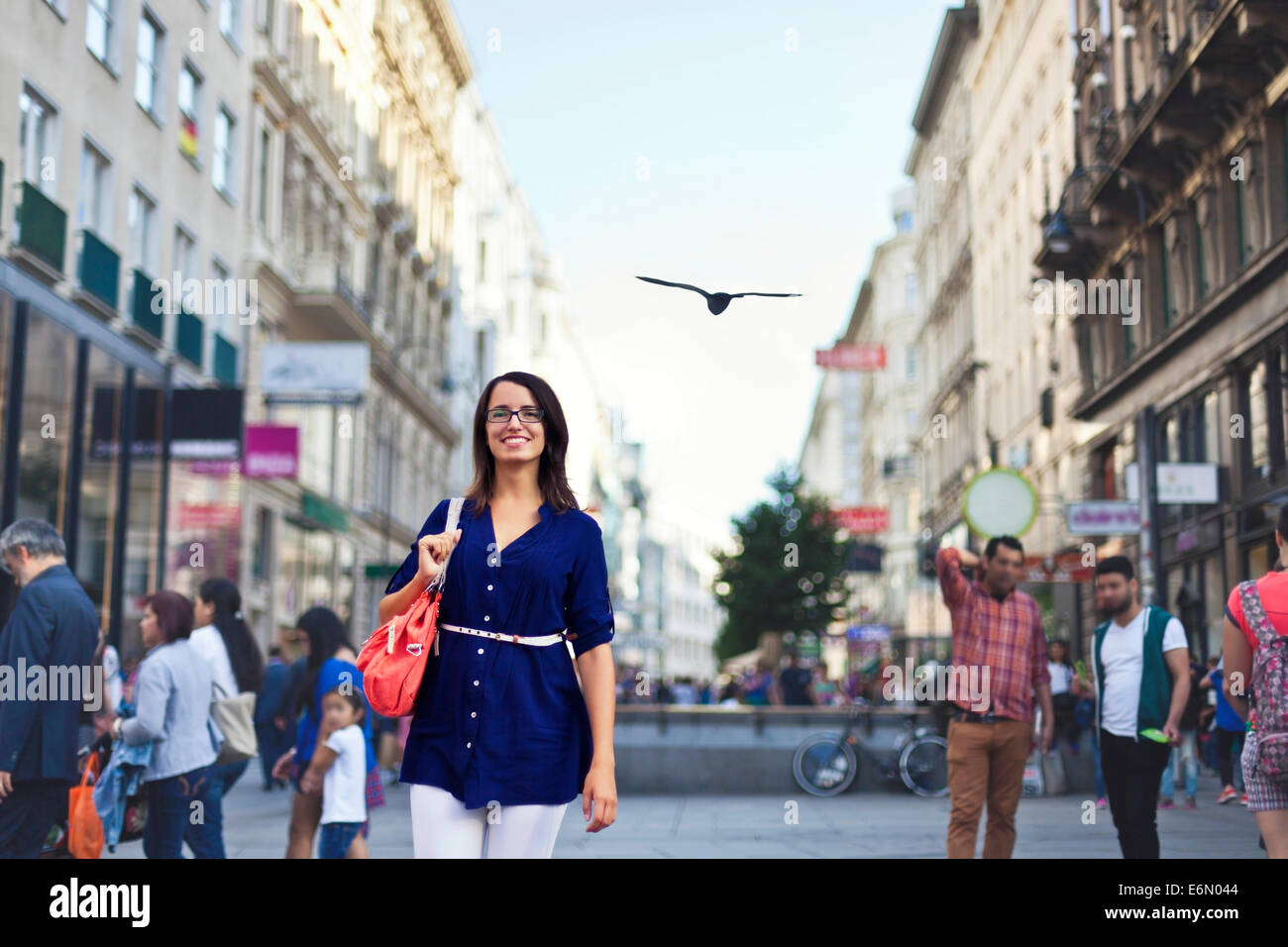 Girl standing out of crowd hi-res stock photography and images - Alamy