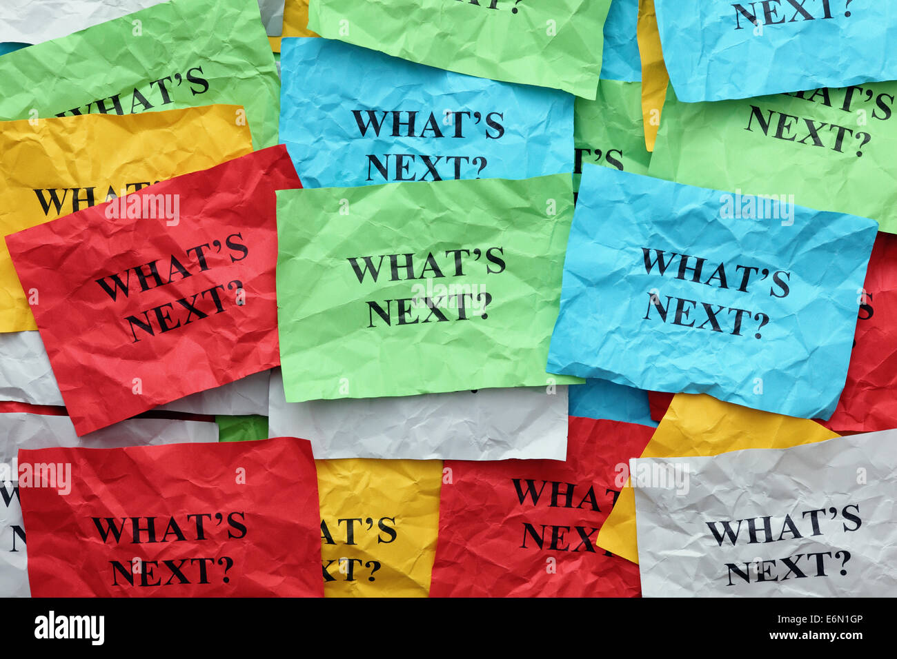Crumpled colorful paper notes with the question "What's next Stock ...