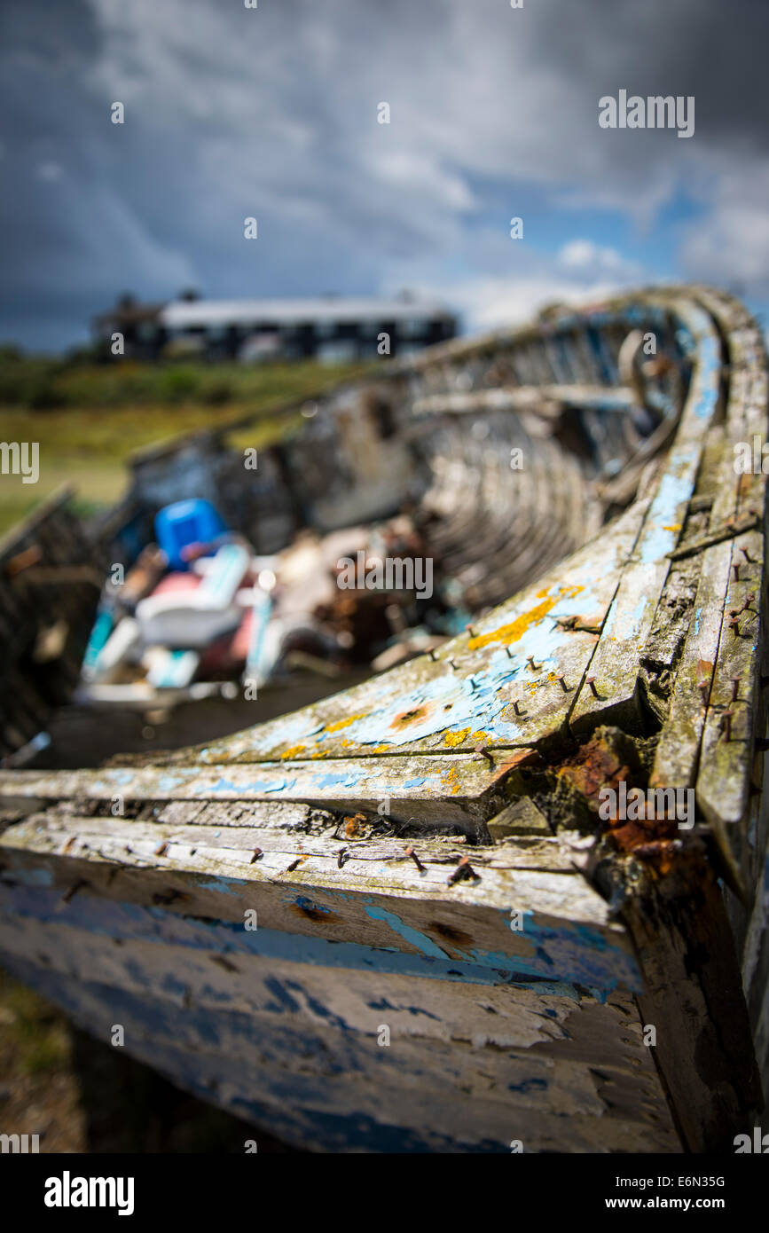 Neglected fishing boat and coastal buildings Stock Photo - Alamy