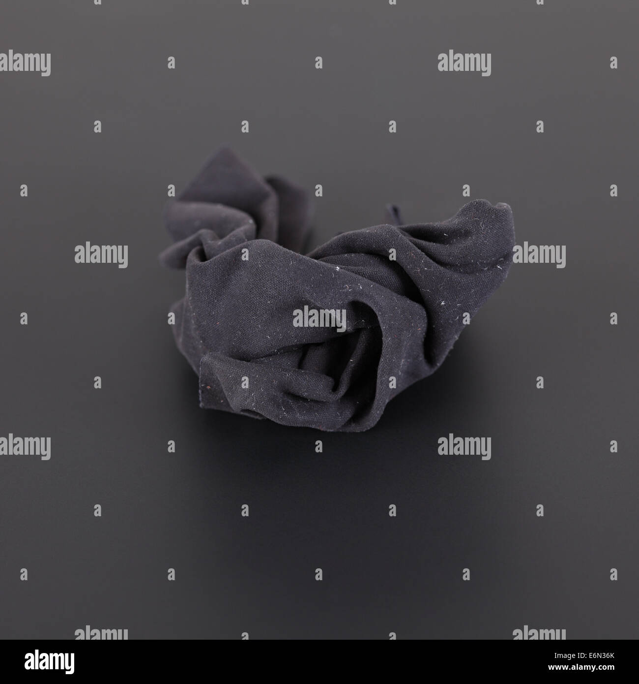 Black dusty rag on a black background Stock Photo - Alamy