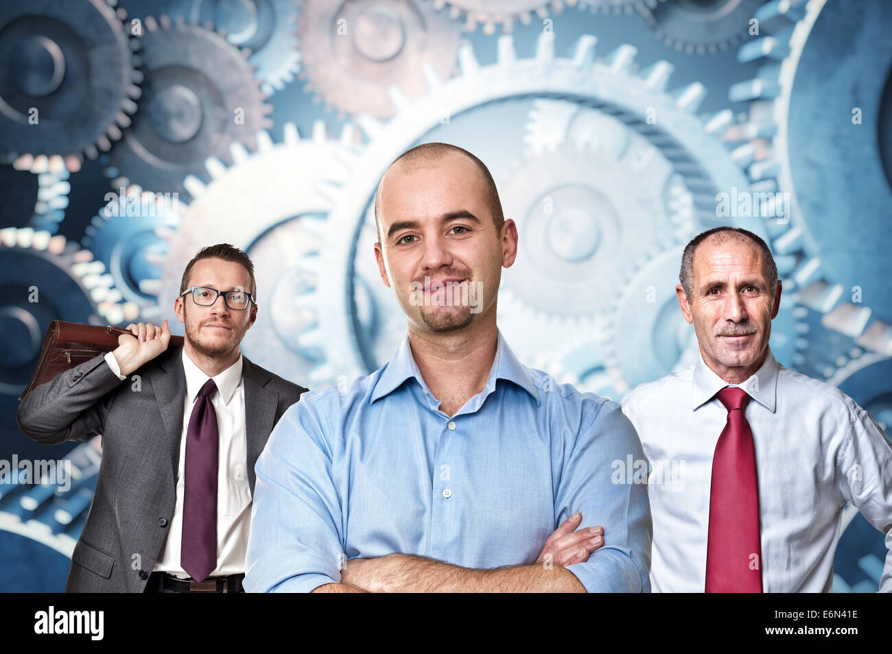 portrait of workers and gear background Stock Photo - Alamy
