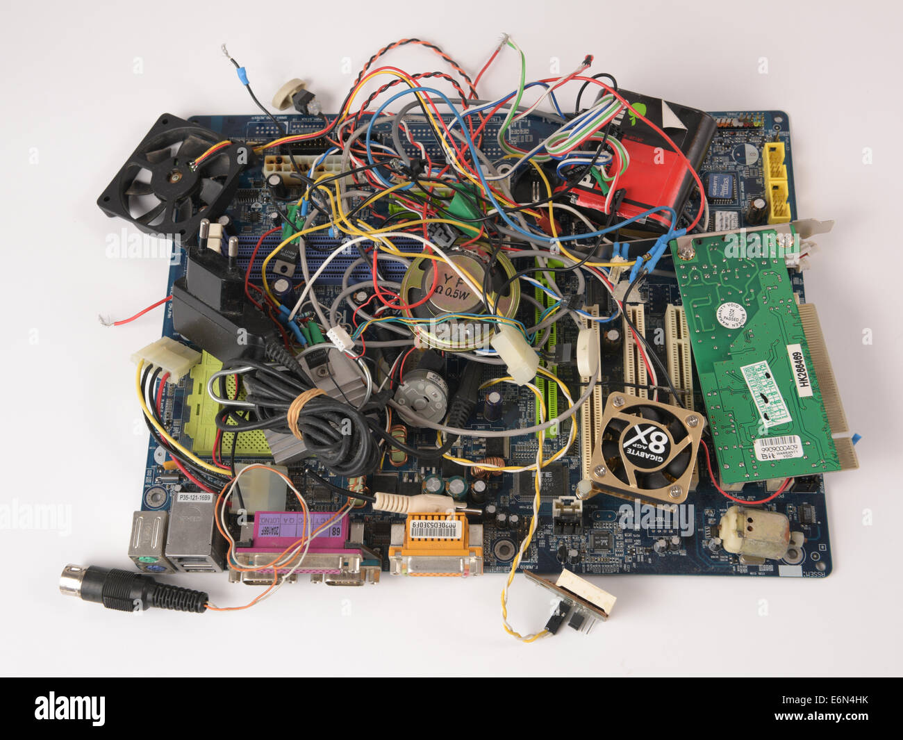 Pile of electronic waste, computer motherboard, wires, battery, some ...