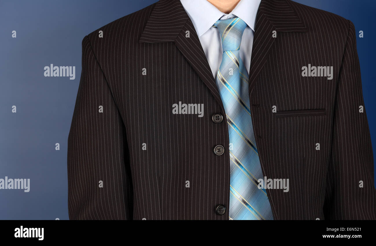 Businessman front of blue background Stock Photo - Alamy