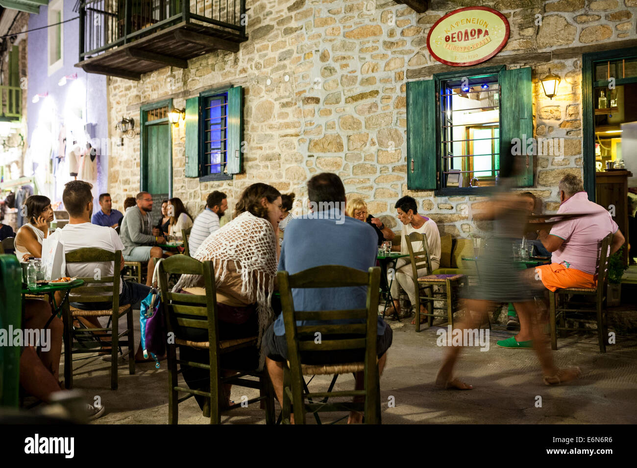 People in a traditional Greek coffee shop (Kafeneio) in the Old Village ...