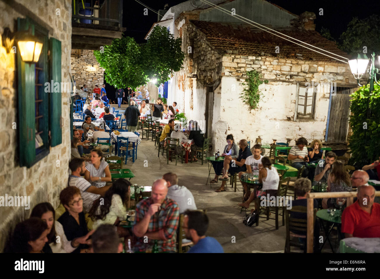 People in a traditional Greek coffee shop (Kafeneio) in the Old Village ...