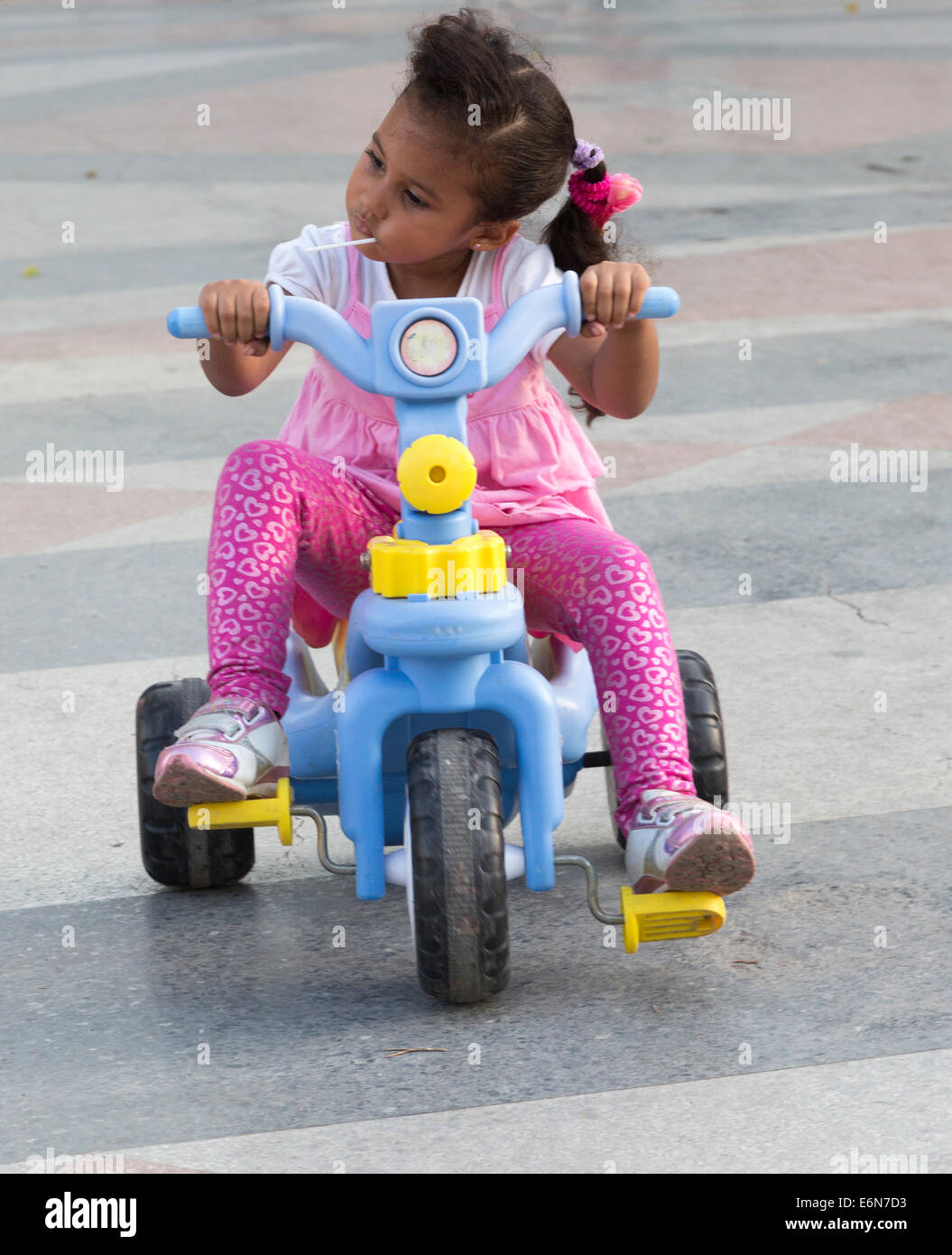 Young Cuban Girl Sucking Lollipop And Riding Tricycle Havana Cuba
