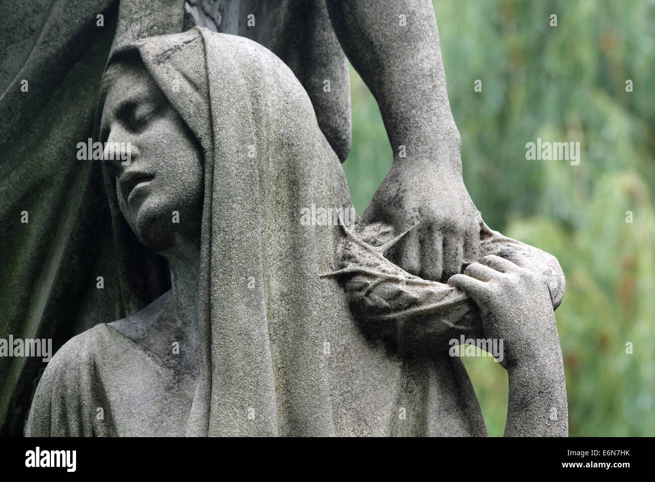 Expressed in the old cemetery tombstone statue grief Stock Photo - Alamy