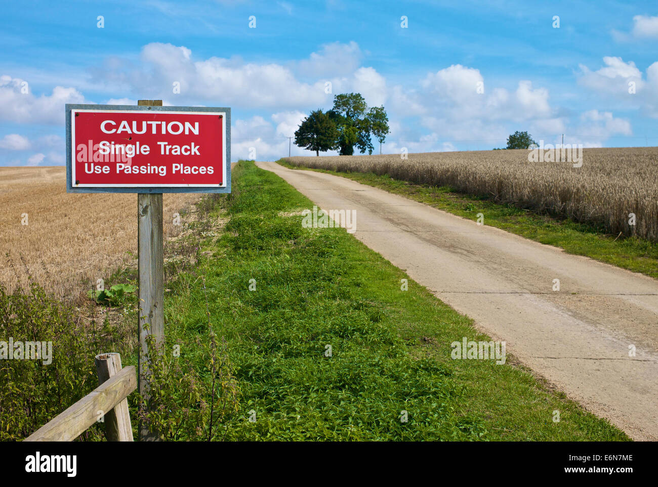 Red sign against blue sky background. Caution Single Track - Use ...