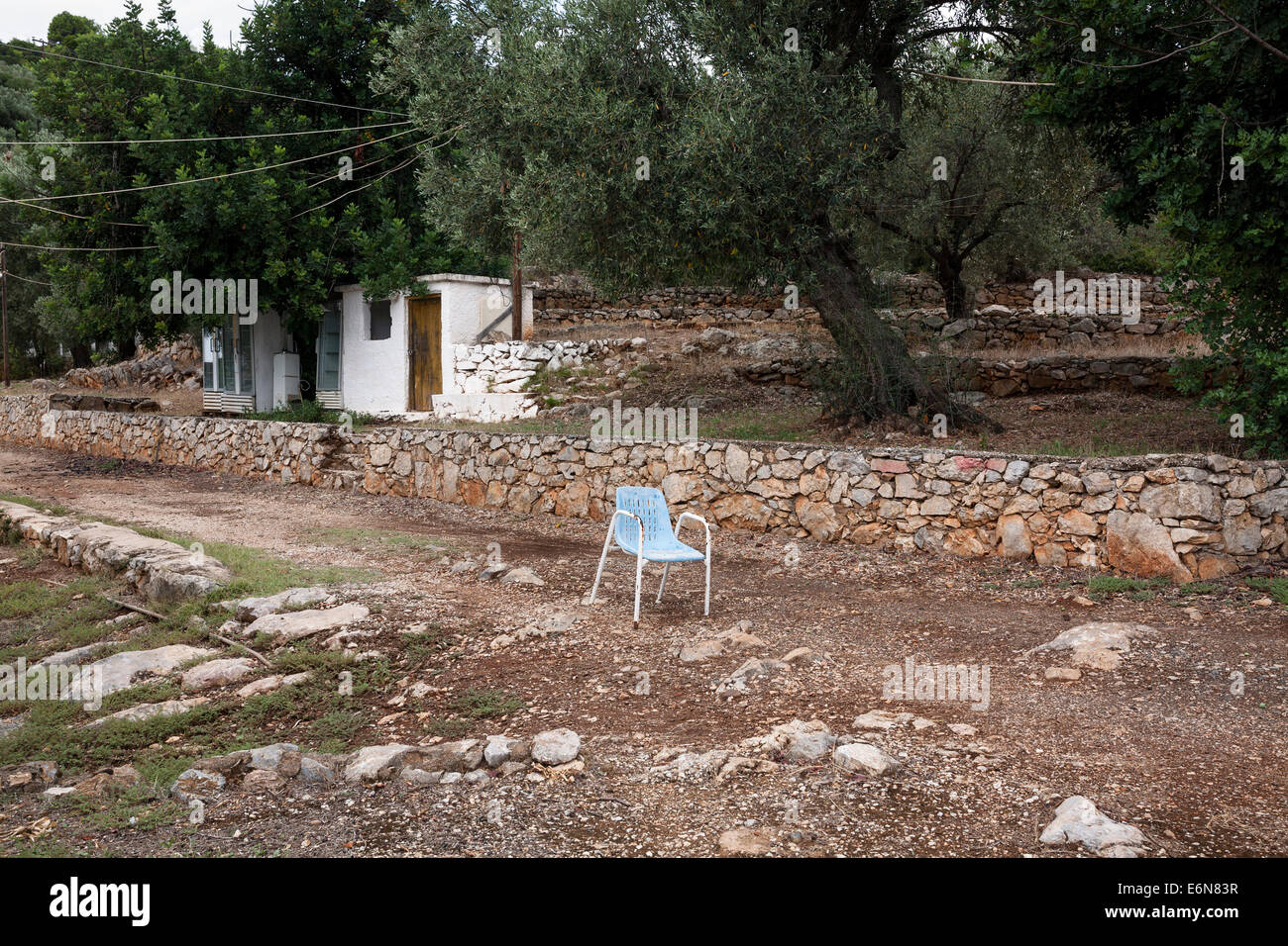 A chair in the middle of a road in Steni Vala village, Alonnisos ...