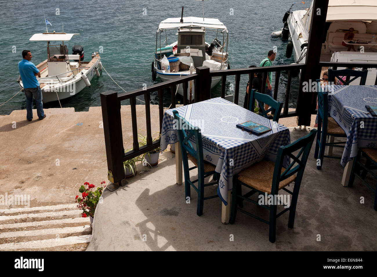 An empty table of a tavern at the harbor village of Steni Vala in ...