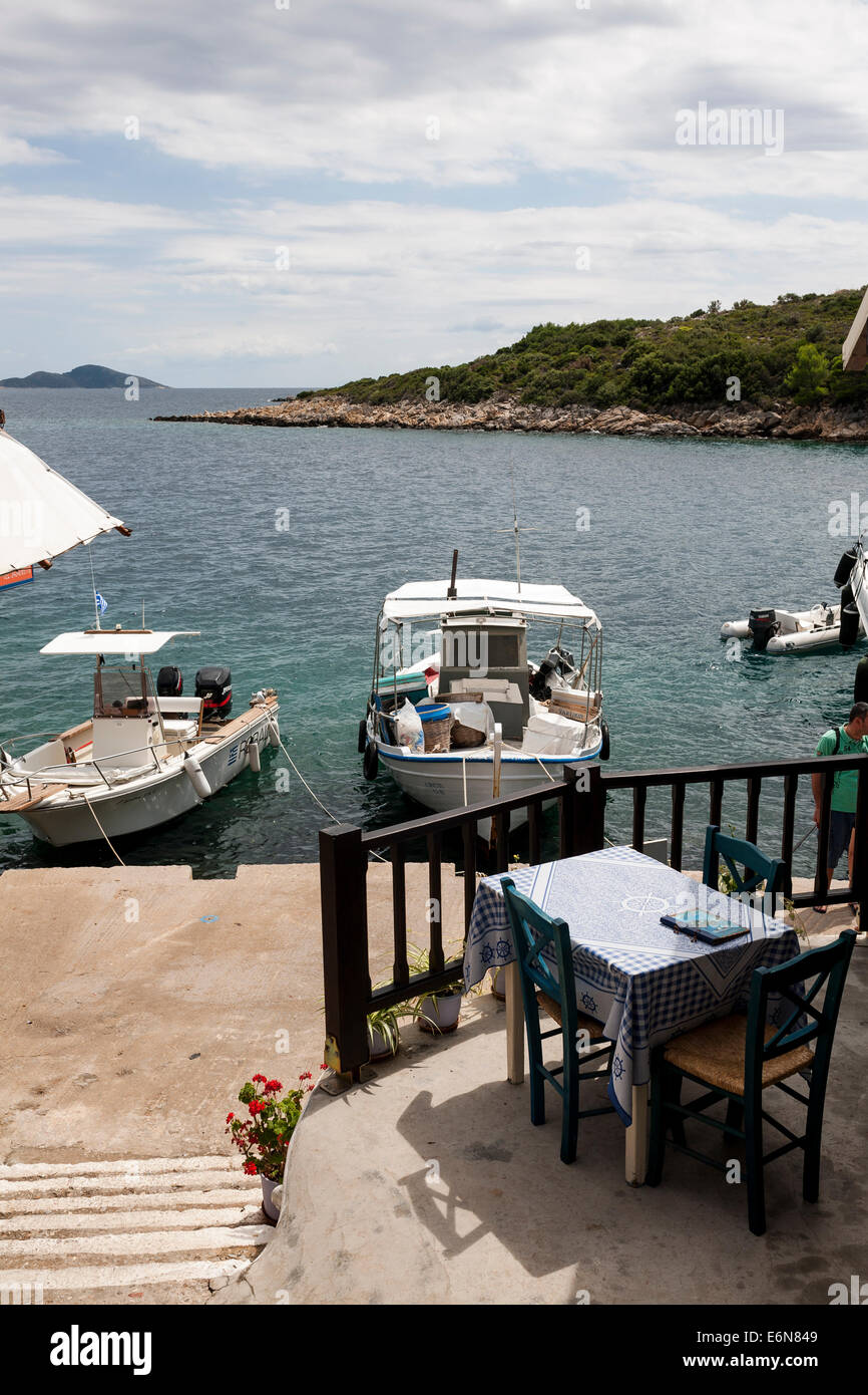 An empty table of a tavern at the harbor village of Steni Vala in ...