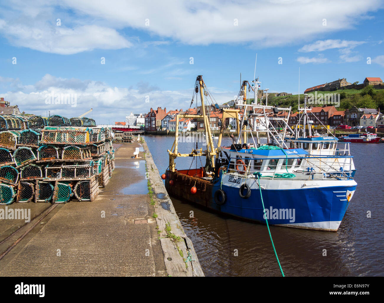 Fishing trawlers and crab pots in the harbour at Whitby, North ...