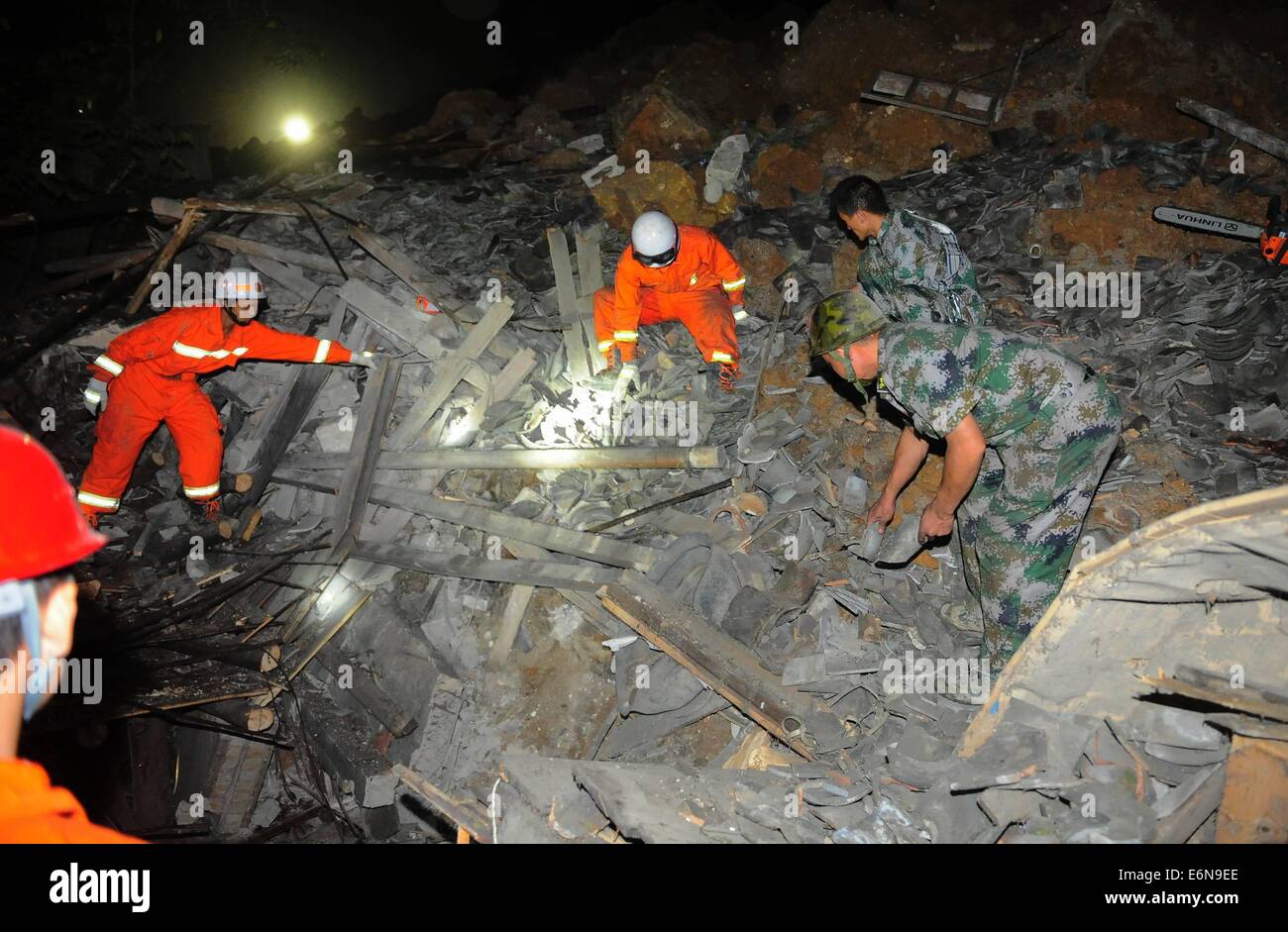 Fuquan, China's Guizhou Province. 27th Aug, 2014. Rescuers work at the ...