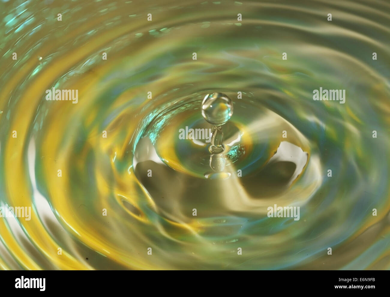 Golden liquid droplet falling hi-res stock photography and images - Alamy
