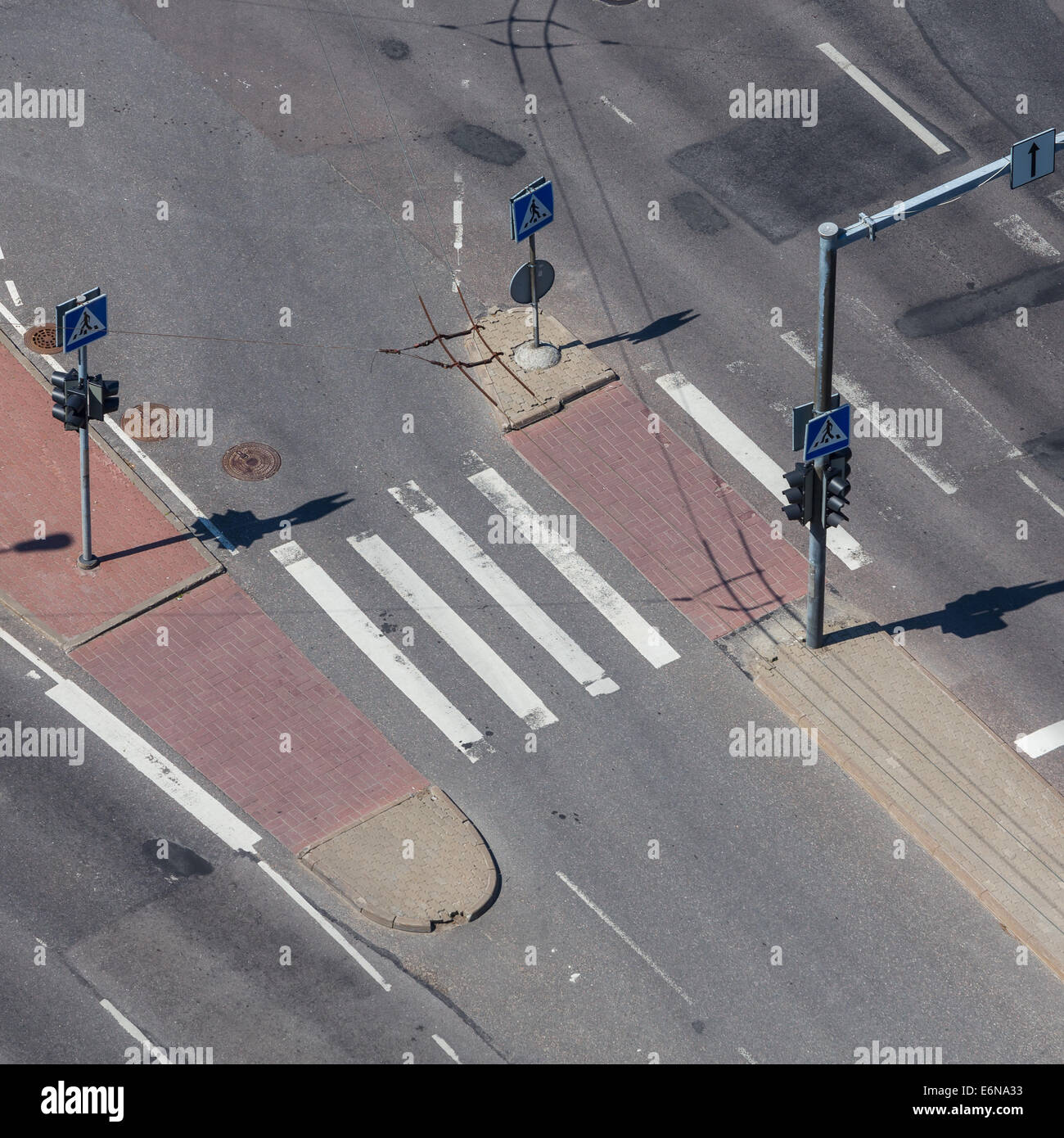high angle view of an empty street intersection with cross walk ...