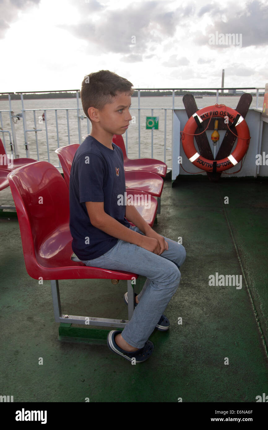 boy on ferry feeling seasick Stock Photo - Alamy
