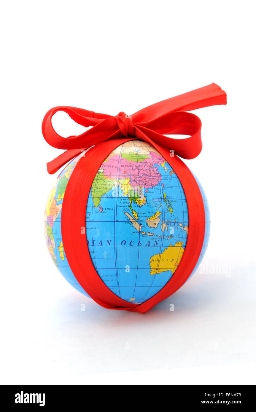 World as a gift, small world with red ribbon, selective focus, isolated ...
