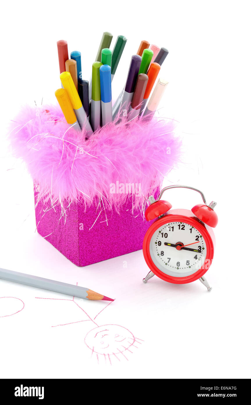 Pink pen cup in the crayon with alarm clock. Education concept Stock ...