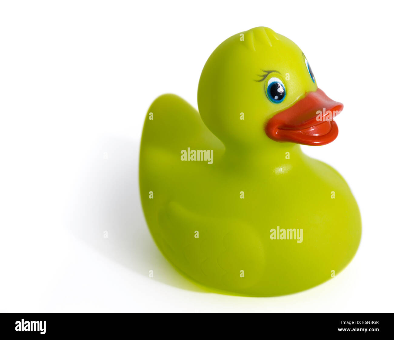 Green plastic bath toy at an angle isolated against a white background ...