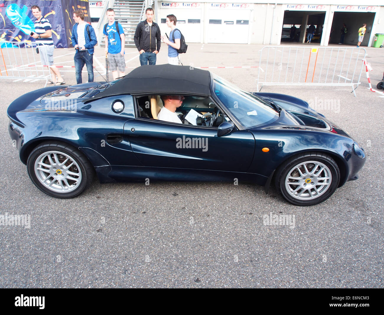A Lotus Elise, a compact sports car known for its lightweight design ...