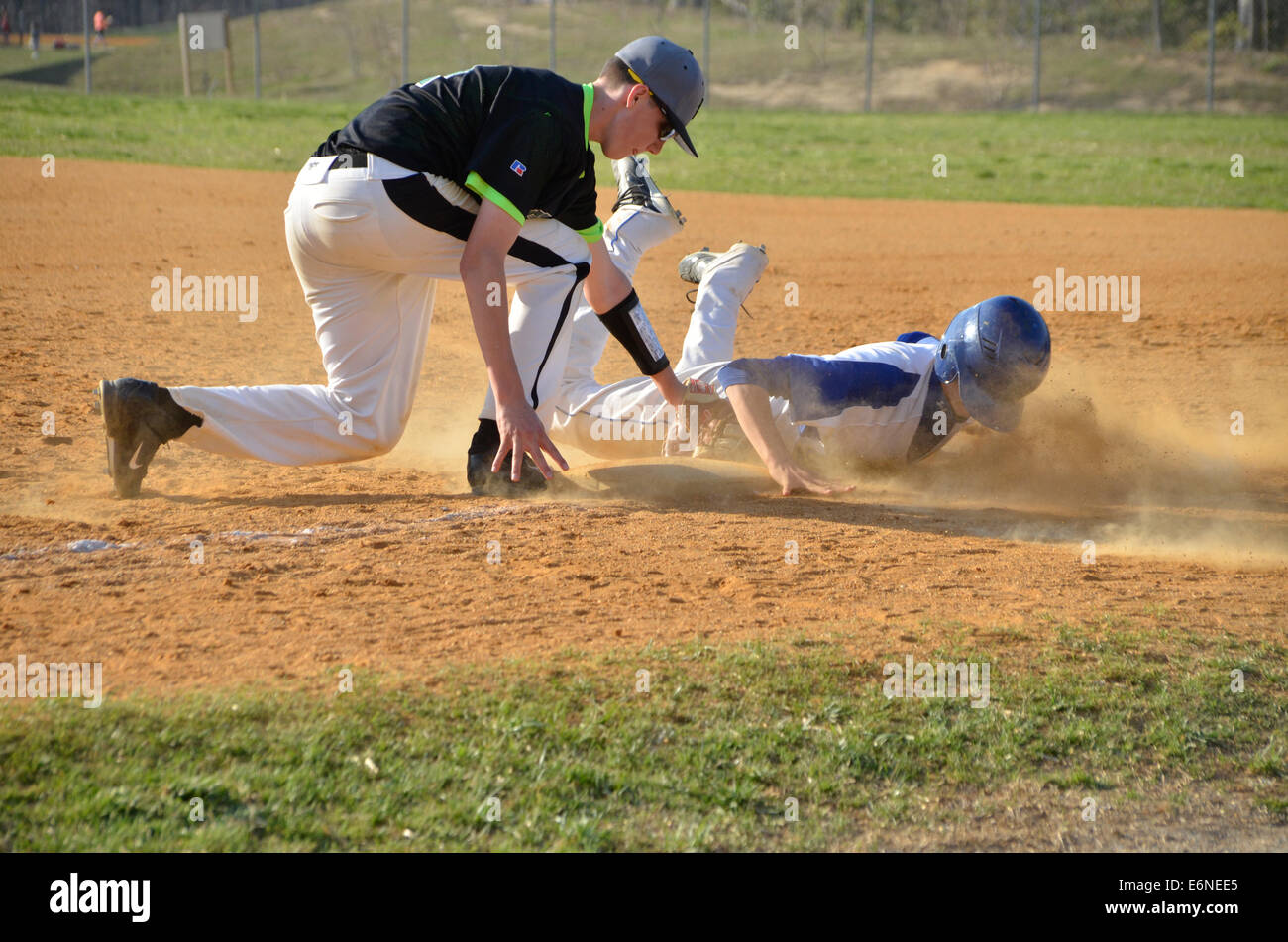 player slides into a base in a baseball game Stock Photo - Alamy