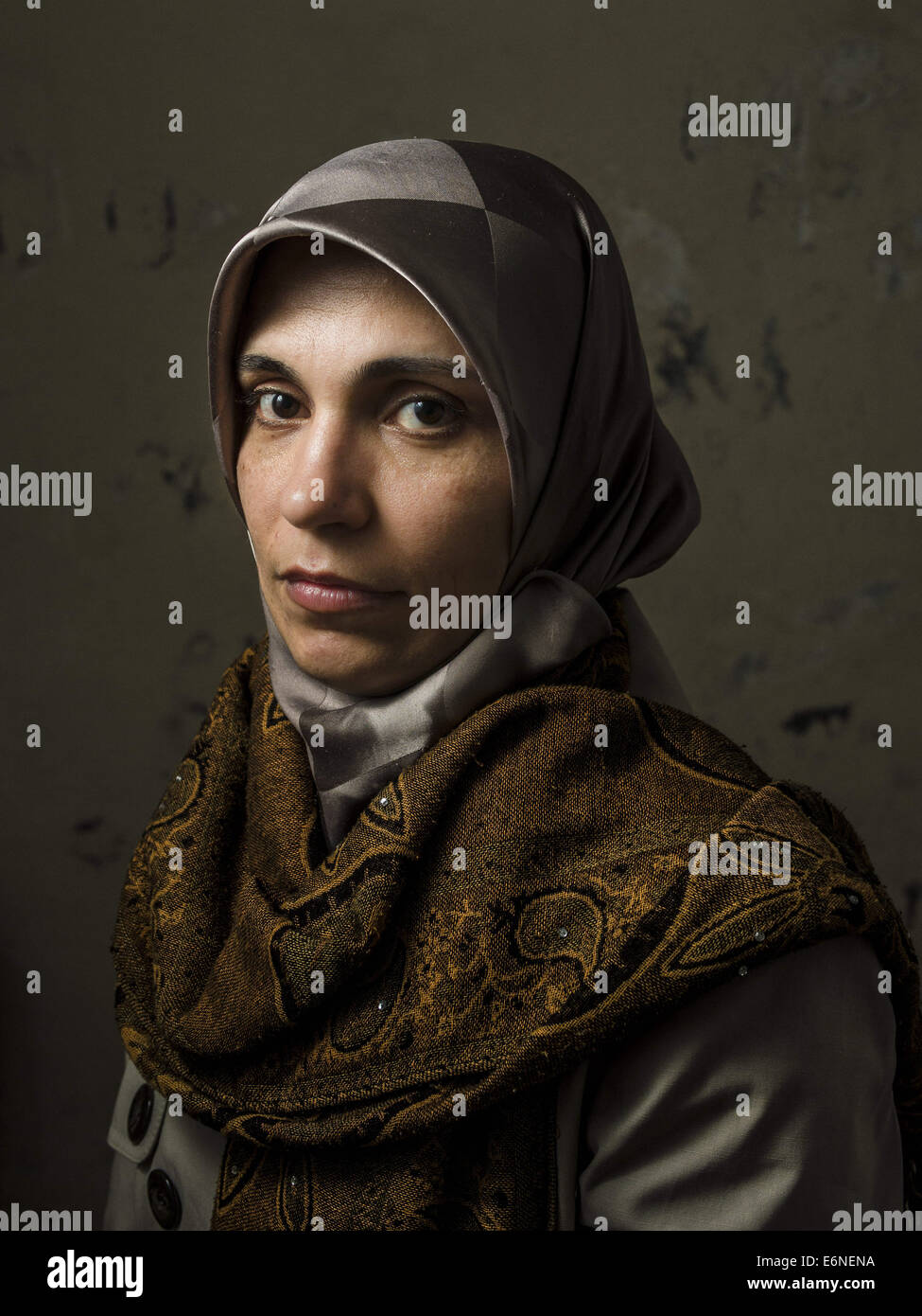 Reyhanli, Turkey. 15th Dec, 2013. Tamador Alomar works as a ...