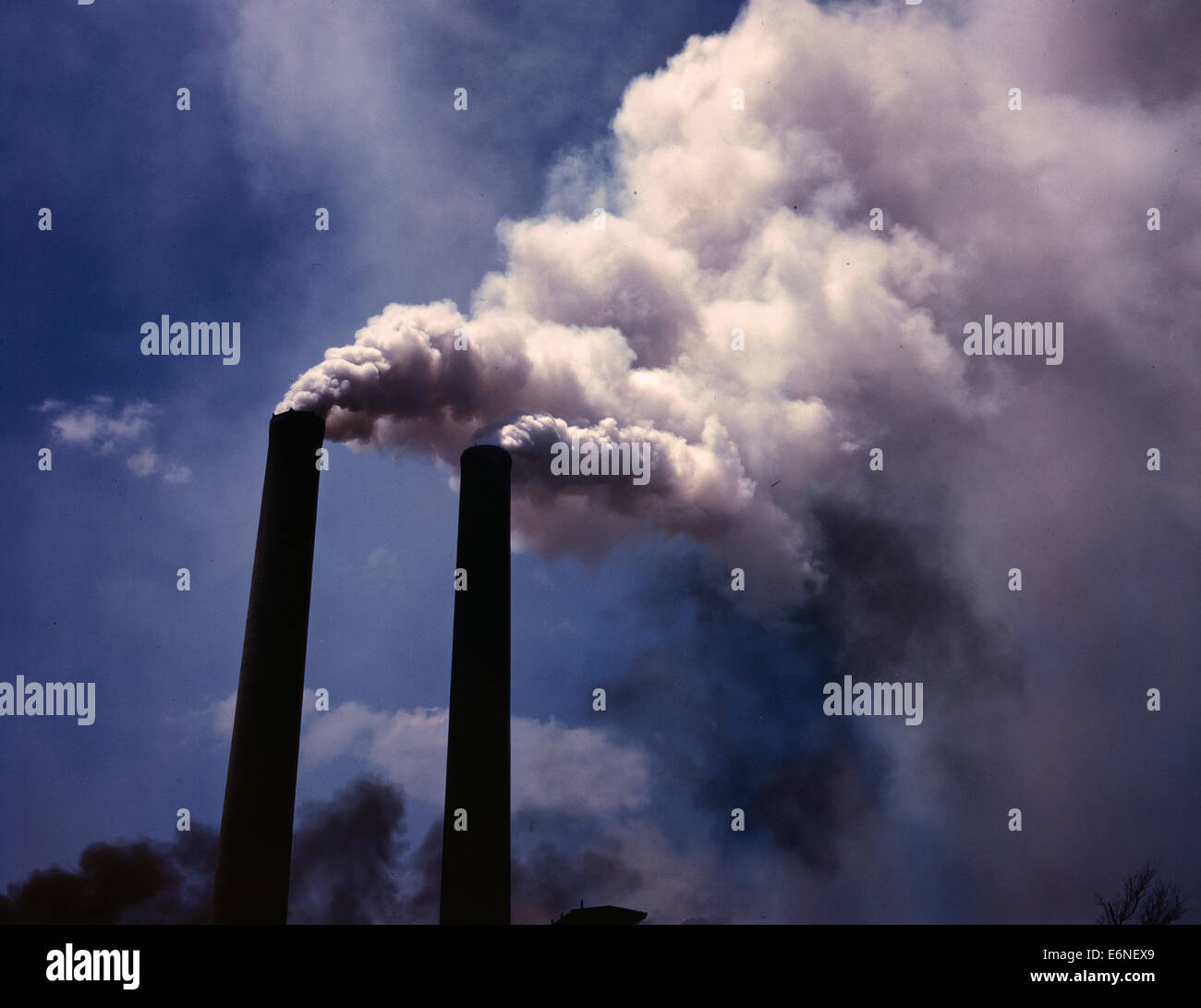 Smoke stacks billowing out smoke - USA industry during World War II ...