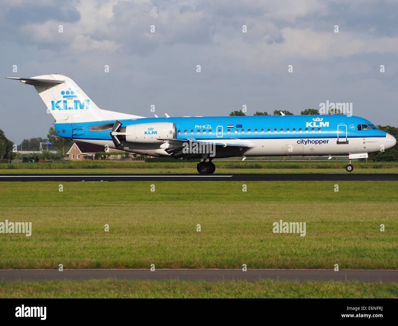 PH-KZL, a KLM Cityhopper Fokker F70, is landing at Schiphol Airport ...