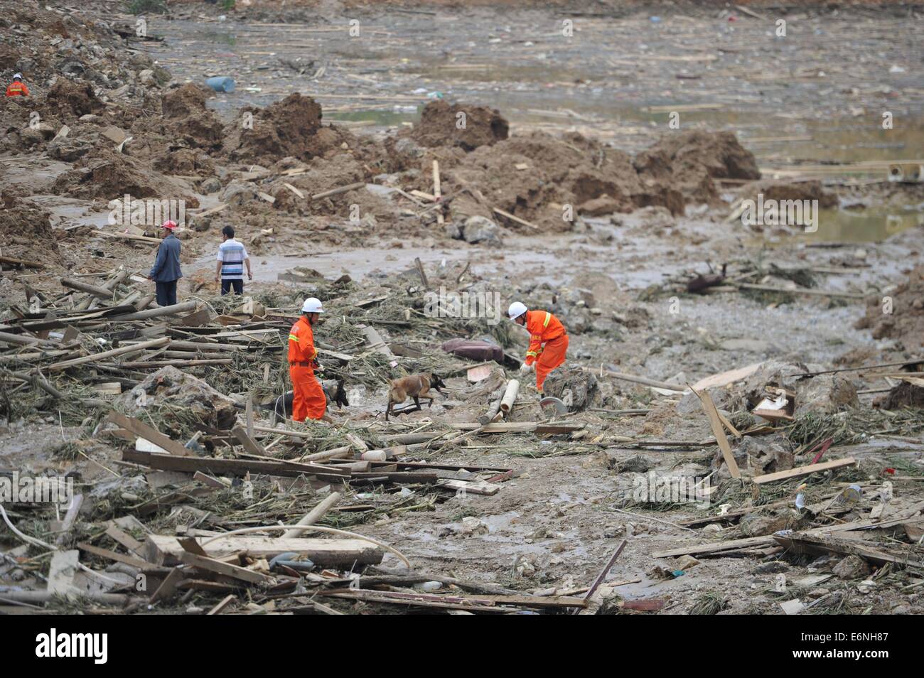 Fuquan, China's Guizhou Province. 28th Aug, 2014. Rescuers work at the ...