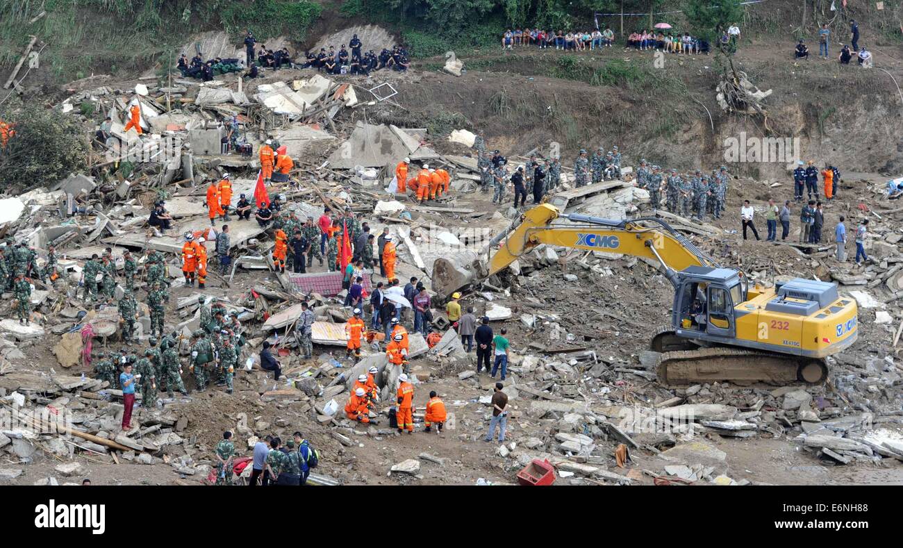 Fuquan, China's Guizhou Province. 28th Aug, 2014. Rescuers work at the ...