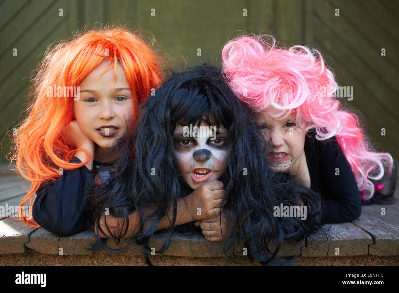 Portrait of three Halloween girls looking at camera with grins Stock ...