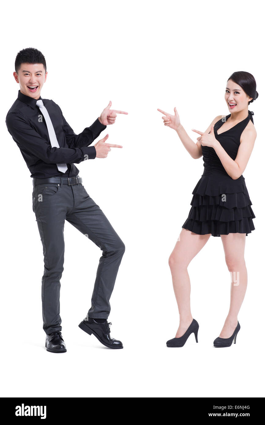 Cheerful black couple pointing hi-res stock photography and images - Alamy