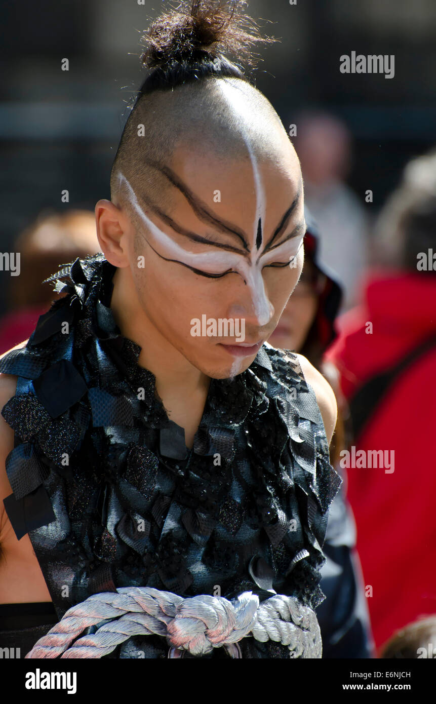 Japanese dancer with strange make-up promoting a show at the annual ...