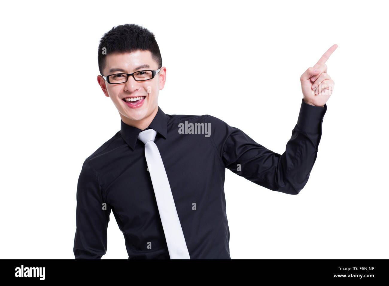 Cheerful young man pointing Stock Photo - Alamy