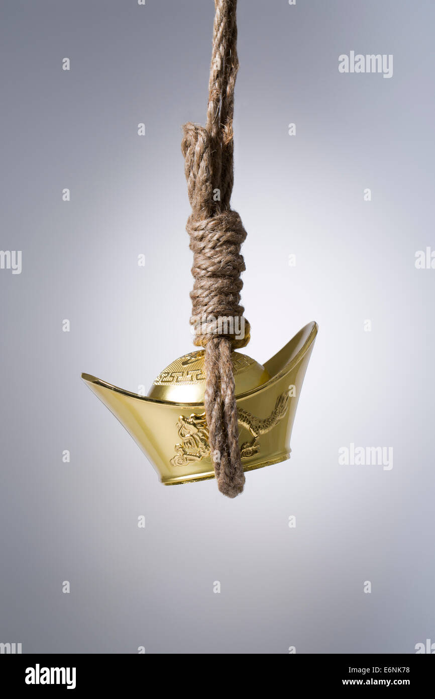 Hanging Chinese traditional currency yuanbao Stock Photo - Alamy