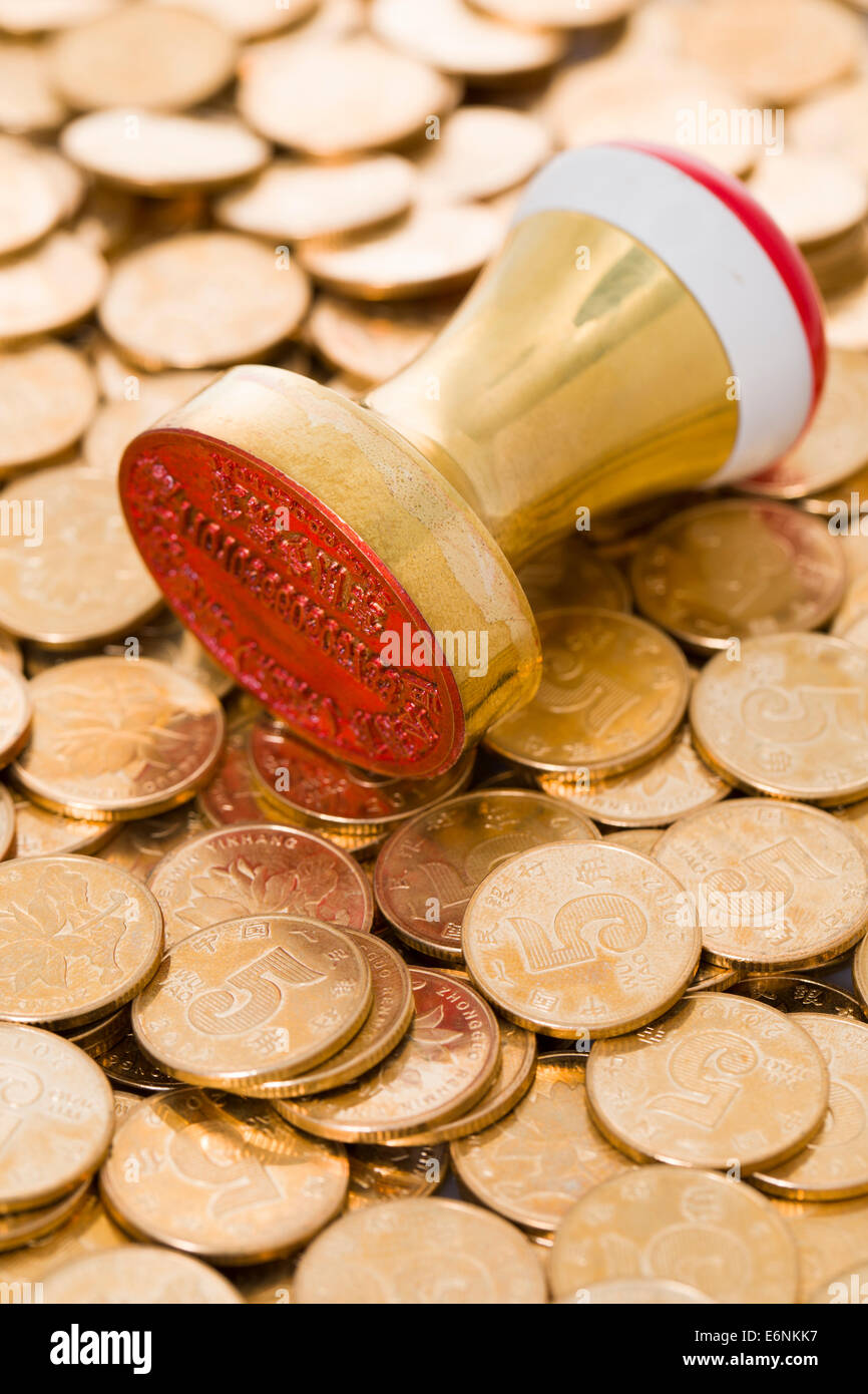 Seal stamper and coins Stock Photo - Alamy