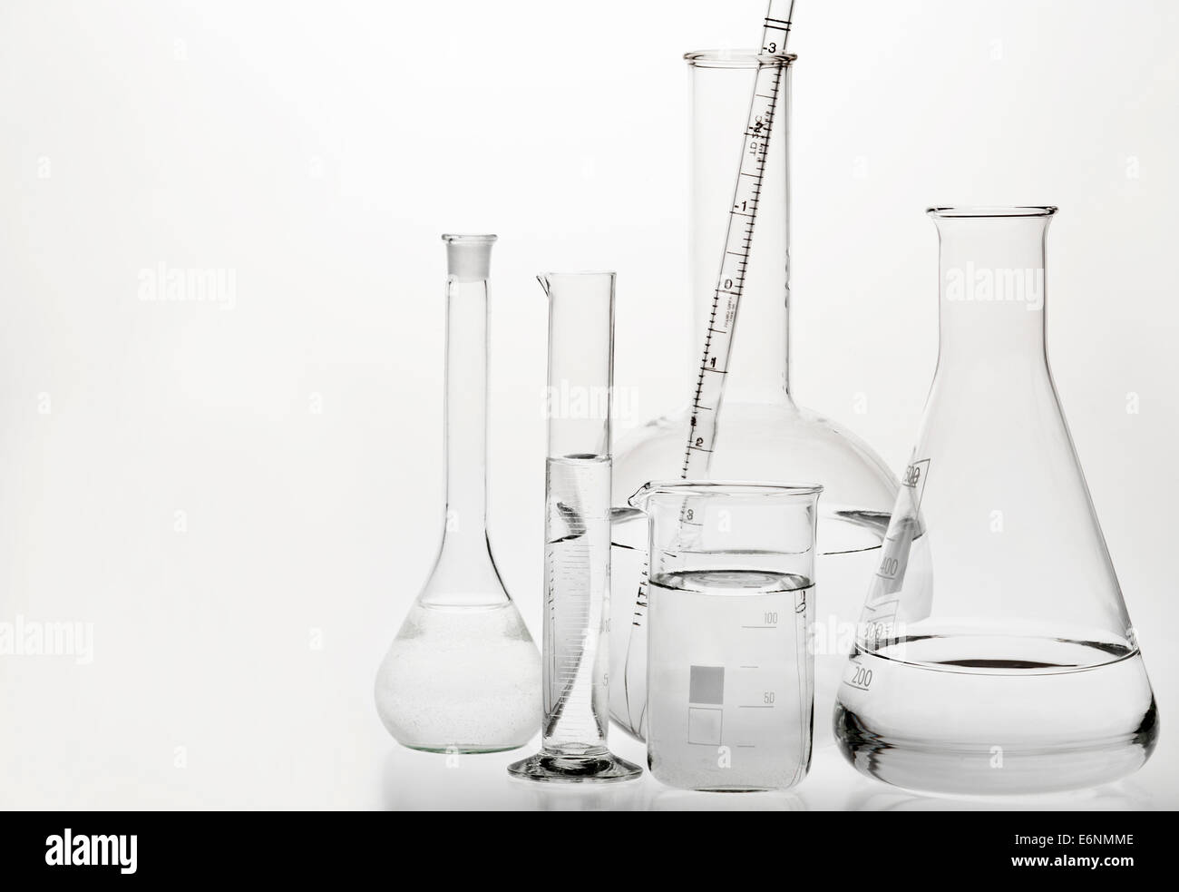 Test-tubes with reflections on a white background. Laboratory glassware ...
