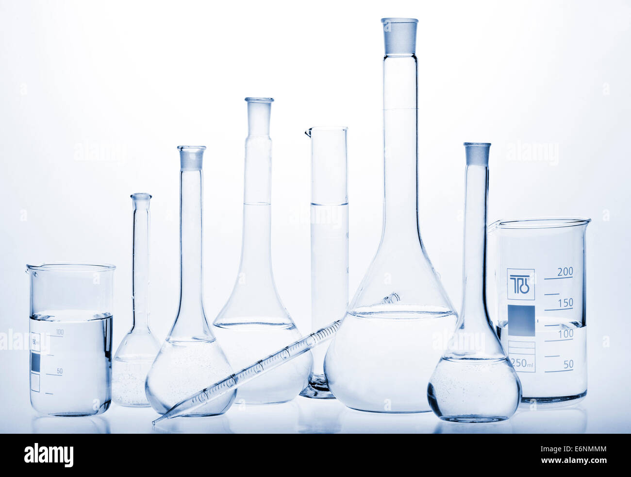 Test-tubes with reflections on a white and blue background. Laboratory ...