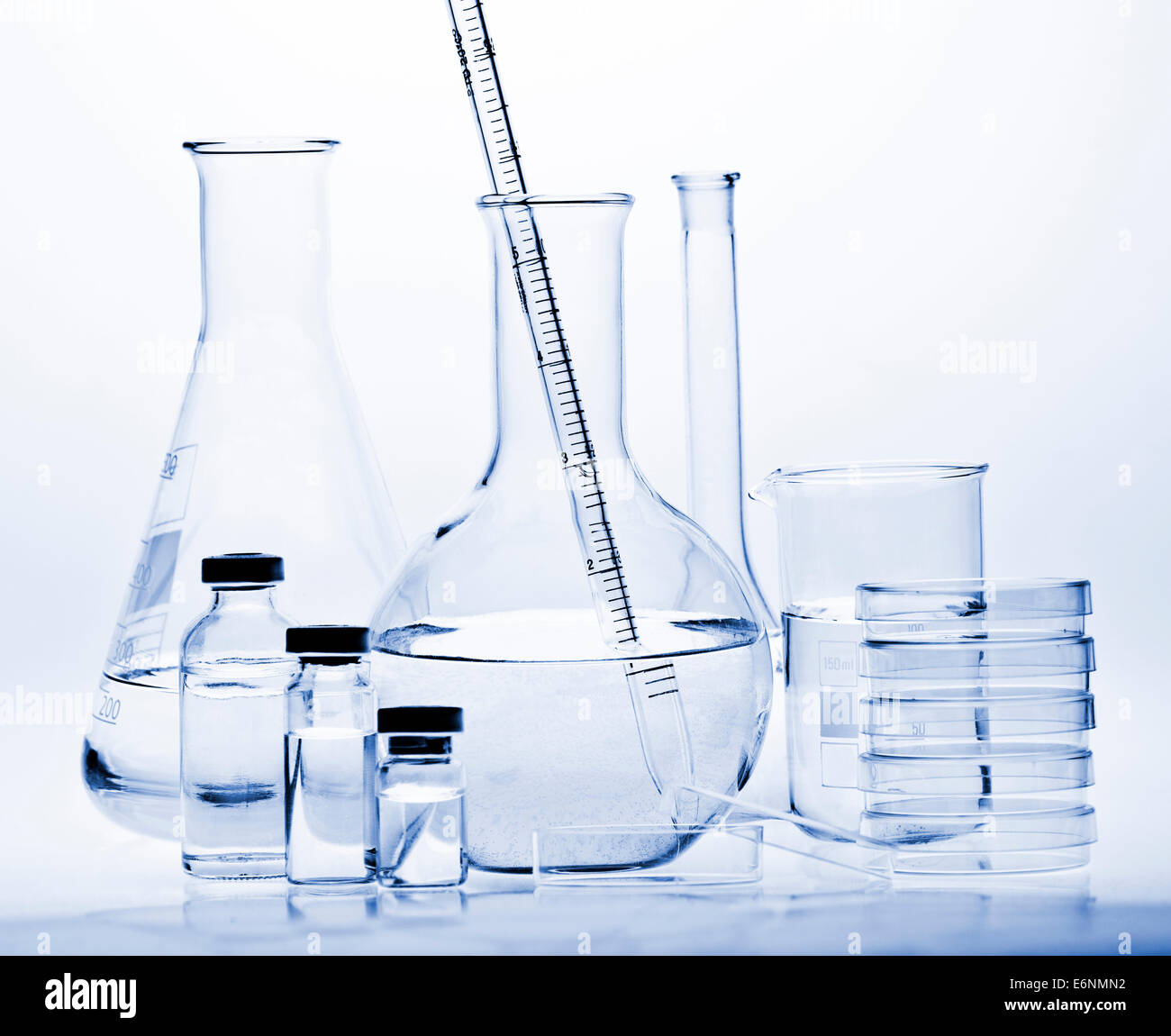 Test-tubes with reflections on a white and blue background. Laboratory ...