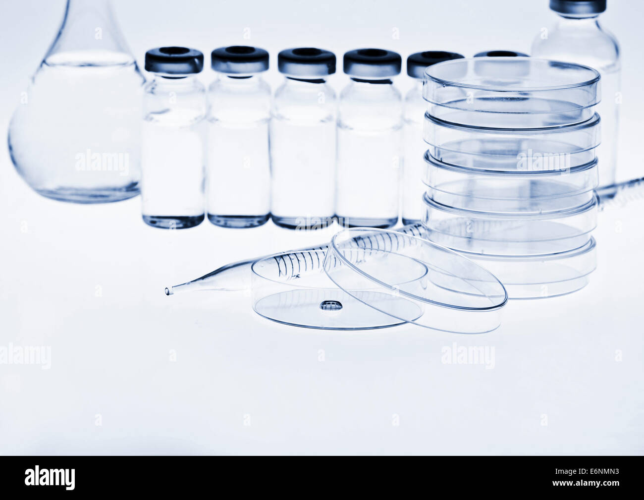 Test-tubes with reflections on a white and blue background. Laboratory ...