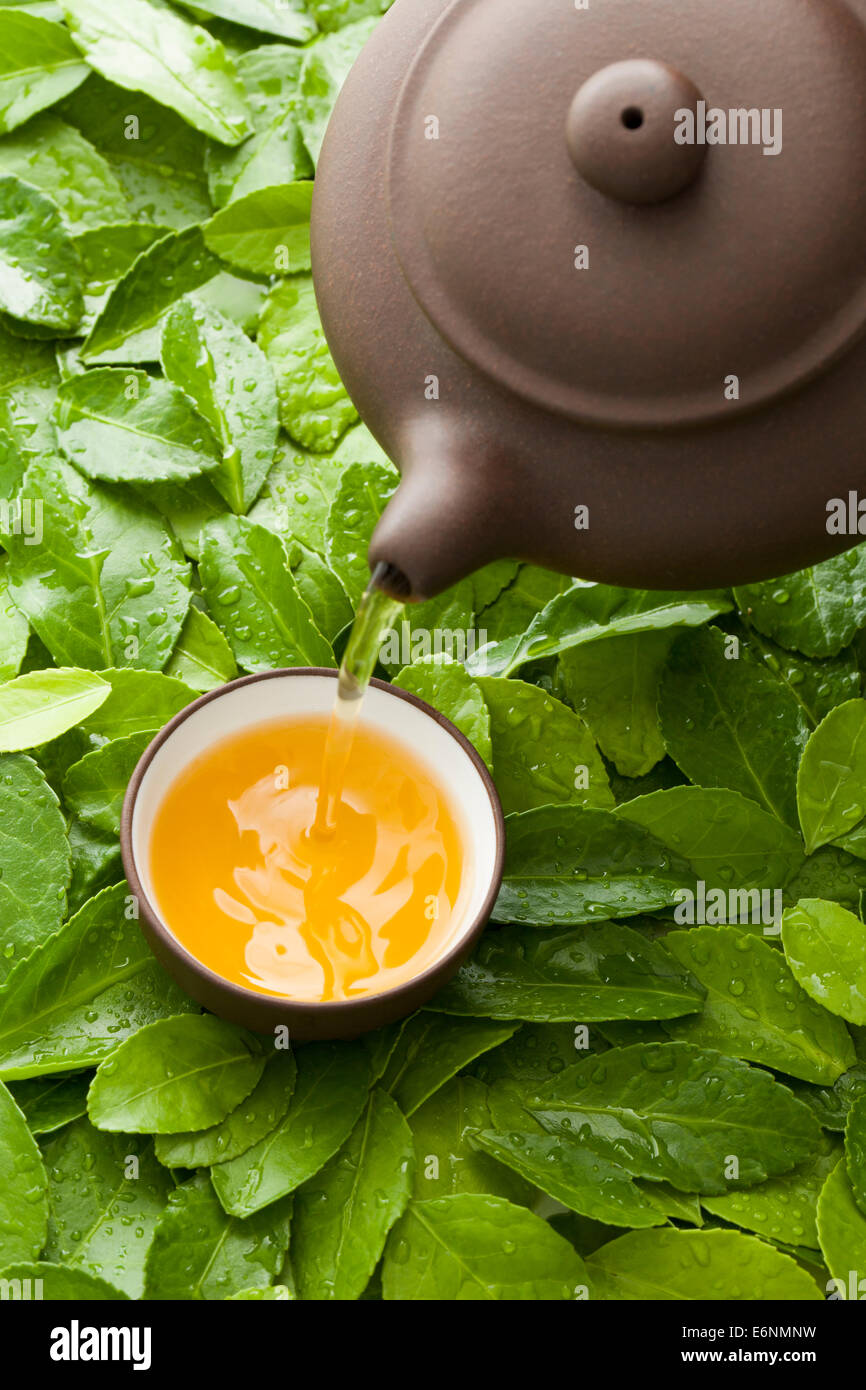 Large teapot pouring tea hi-res stock photography and images - Alamy