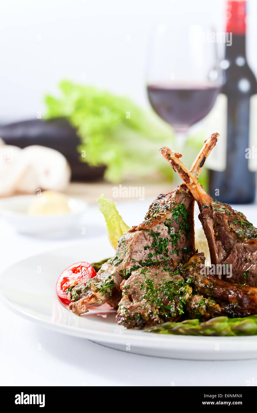 Stewed mutton with grilled vegetables on a white plate Stock Photo - Alamy