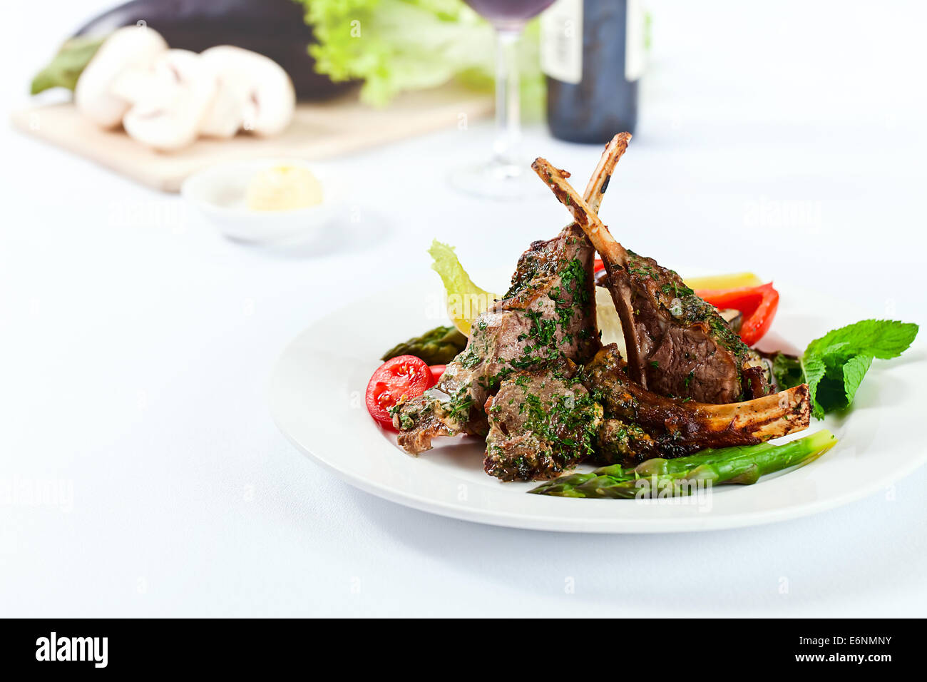 Stewed mutton with grilled vegetables on a white plate Stock Photo - Alamy